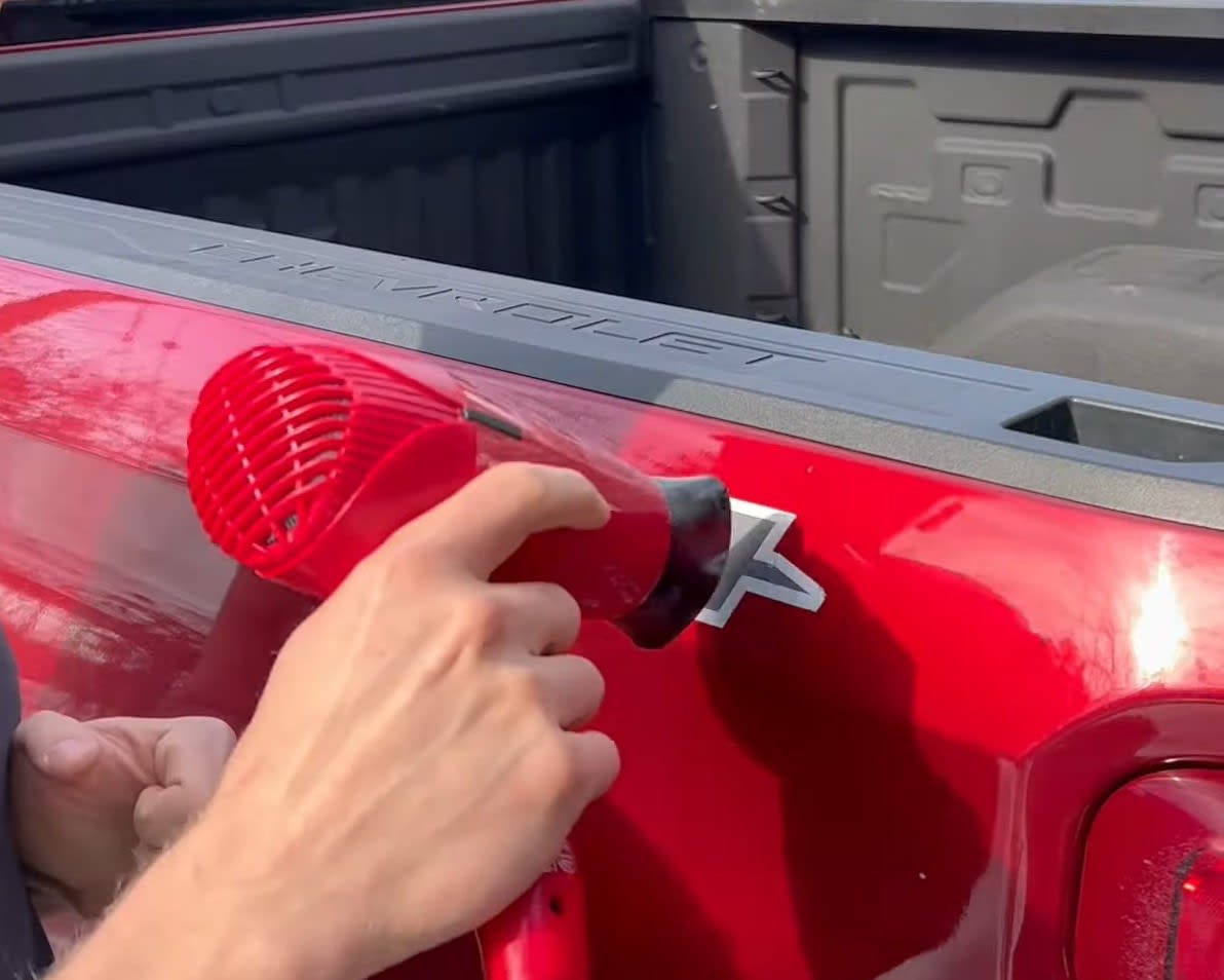 How to Remove Car Decals Safely Without Damaging Paint - AxleAddict